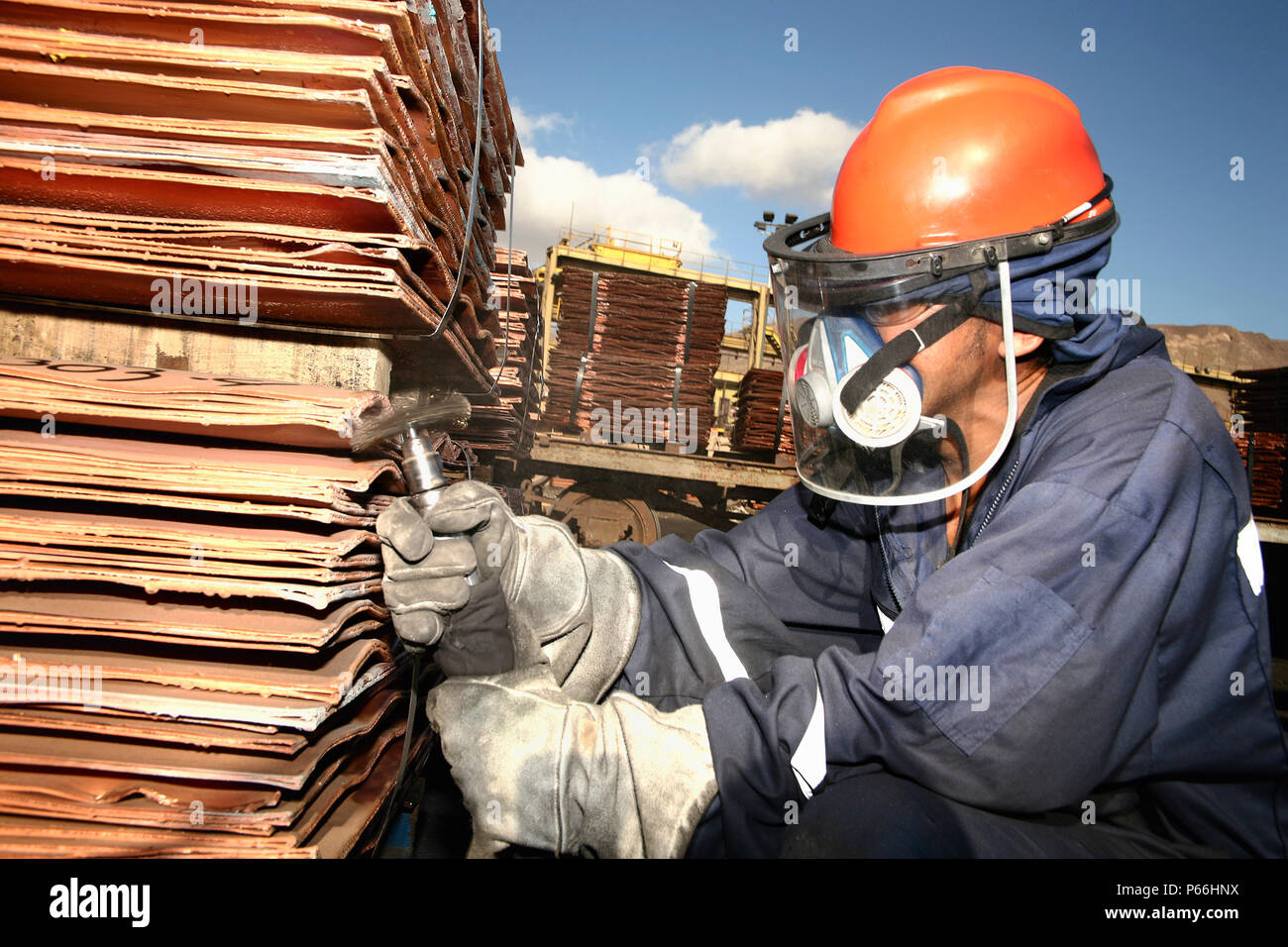 Man Polishing Copper Cathodes before dispatch in Antofagasta, Chile ...