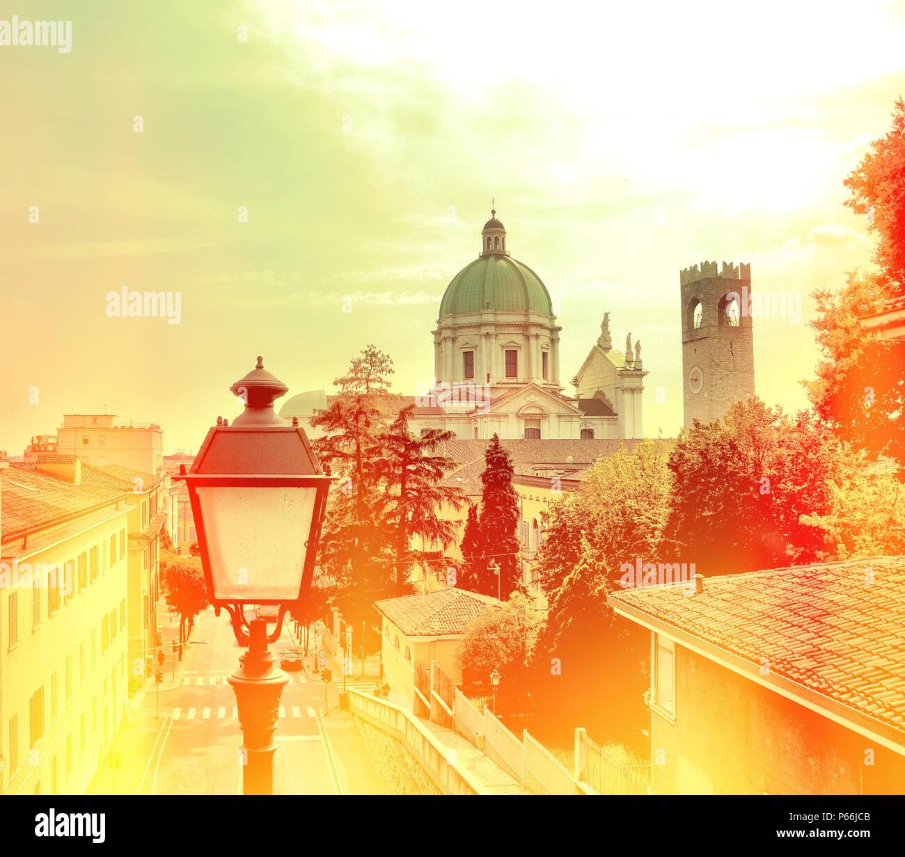 Italian cityscape with baroque dome and medieval tower. Fire and flames ...