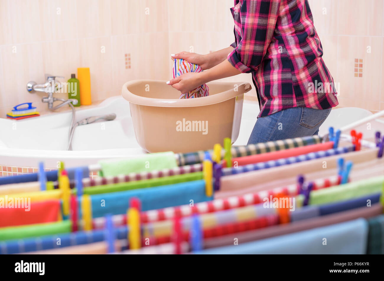 Women's hands wash clothes in the basin Stock Photo - Alamy