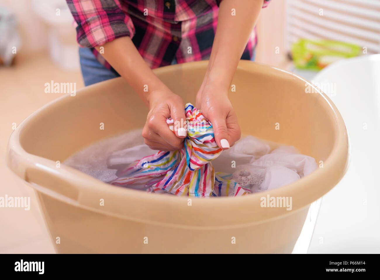 Women's hands wash clothes in the basin Stock Photo - Alamy