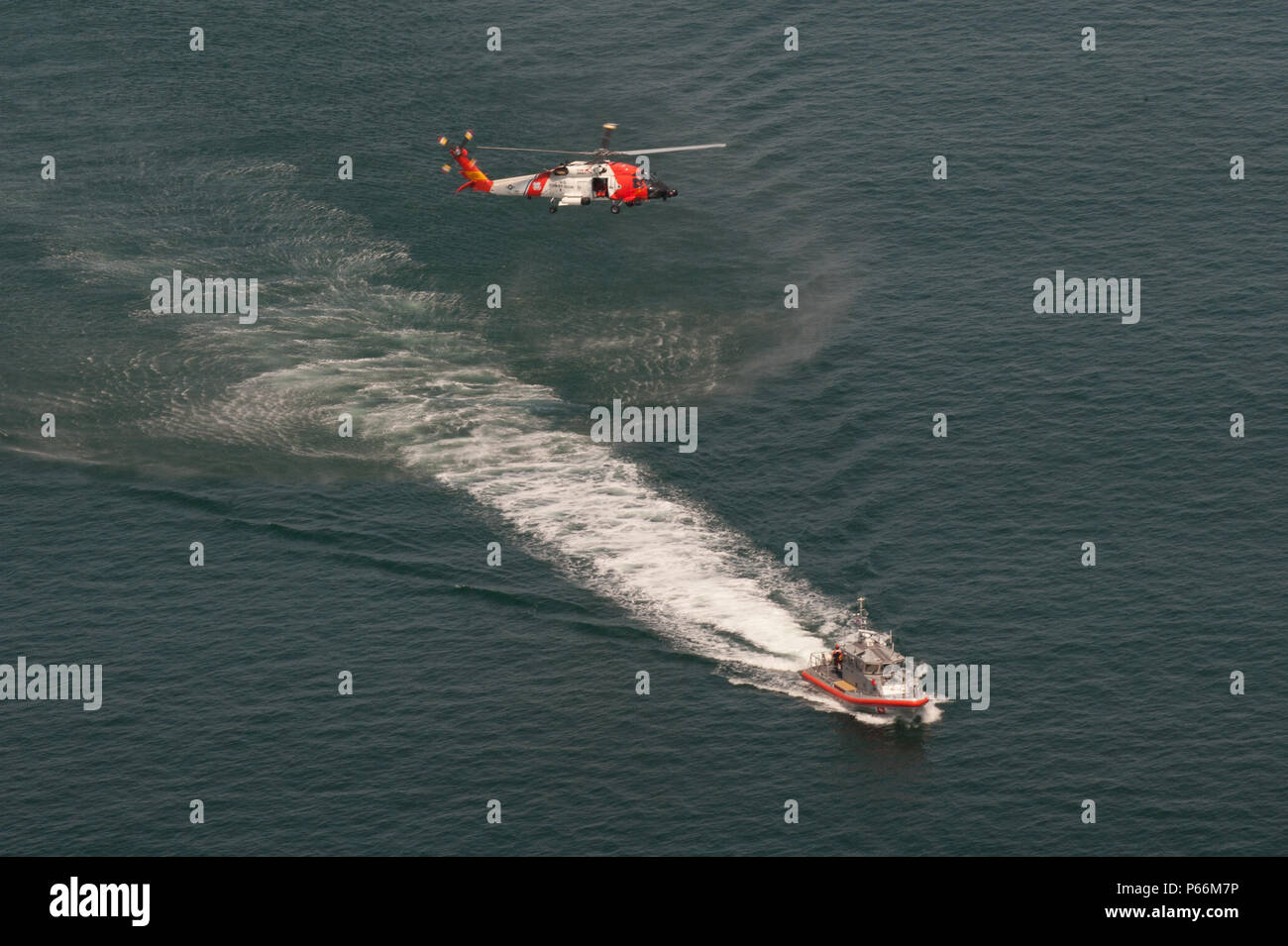 A Coast Guard MH-60 Jayhawk helicopter from Air Station Cape Cod flies ...