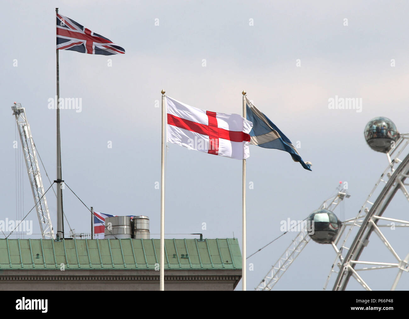 A Union Flag, St George's flag and the Saltire flying over Whitehall ...