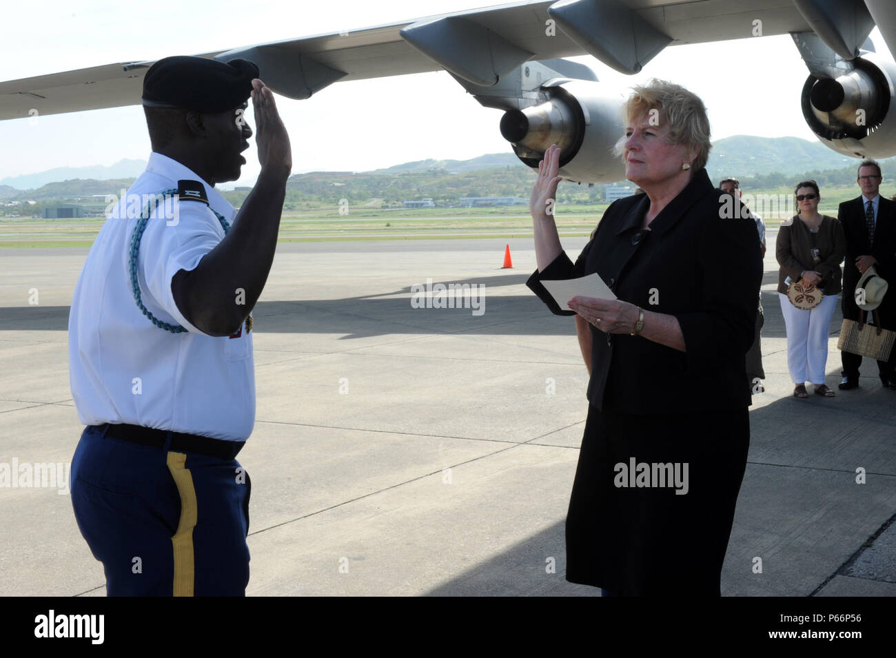 U.S. Army Capt. Marvin Ryals reaffirms the oath of office administered ...