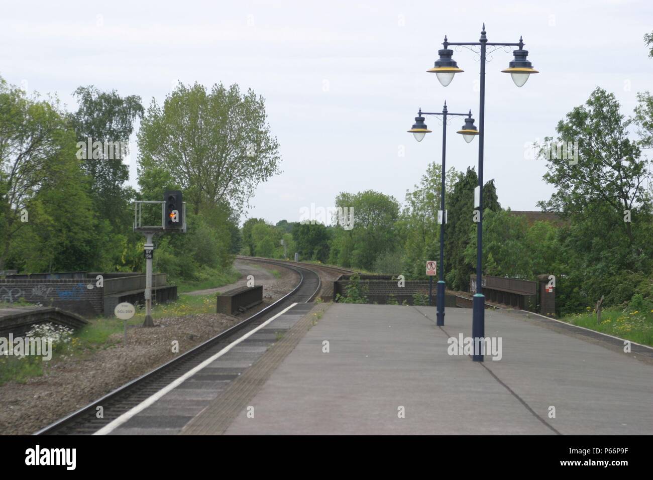 General view of the platform showing platform lighting and signalling ...
