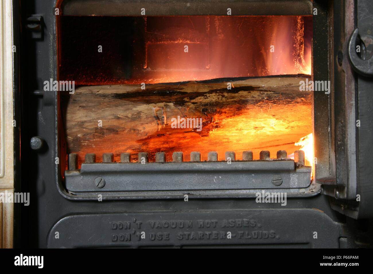 Wood burning in the fireplace at home Stock Photo - Alamy