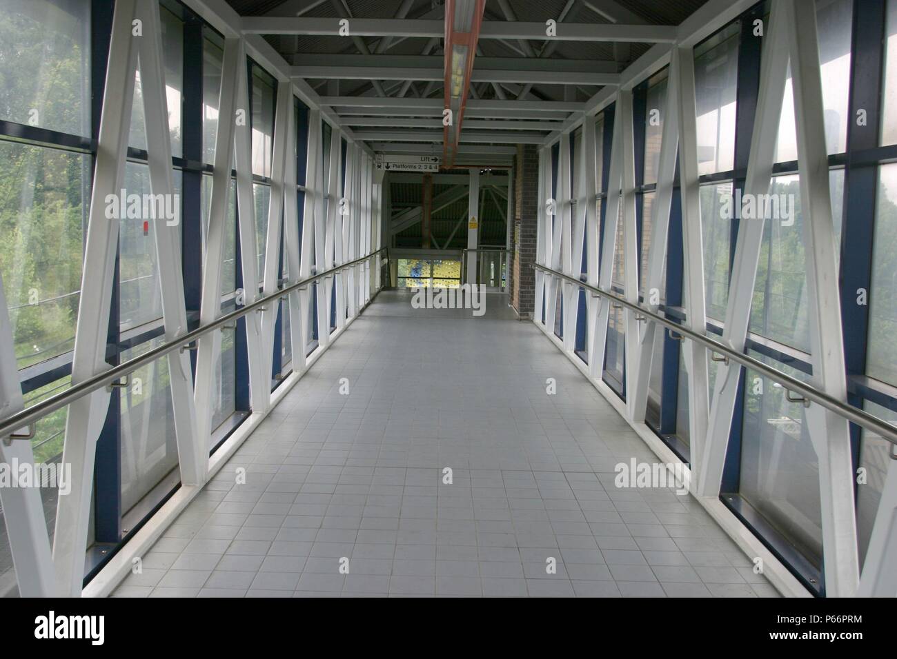 Glazed pedestrian access bridge at Smethwick Galton Bridge station ...