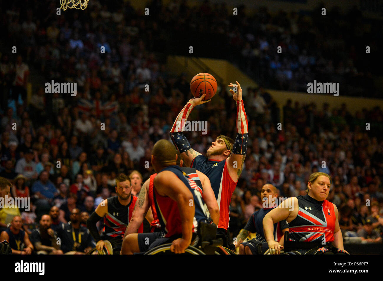 U.S. Navy veteran Adam Hygema takes a shot in the championship ...