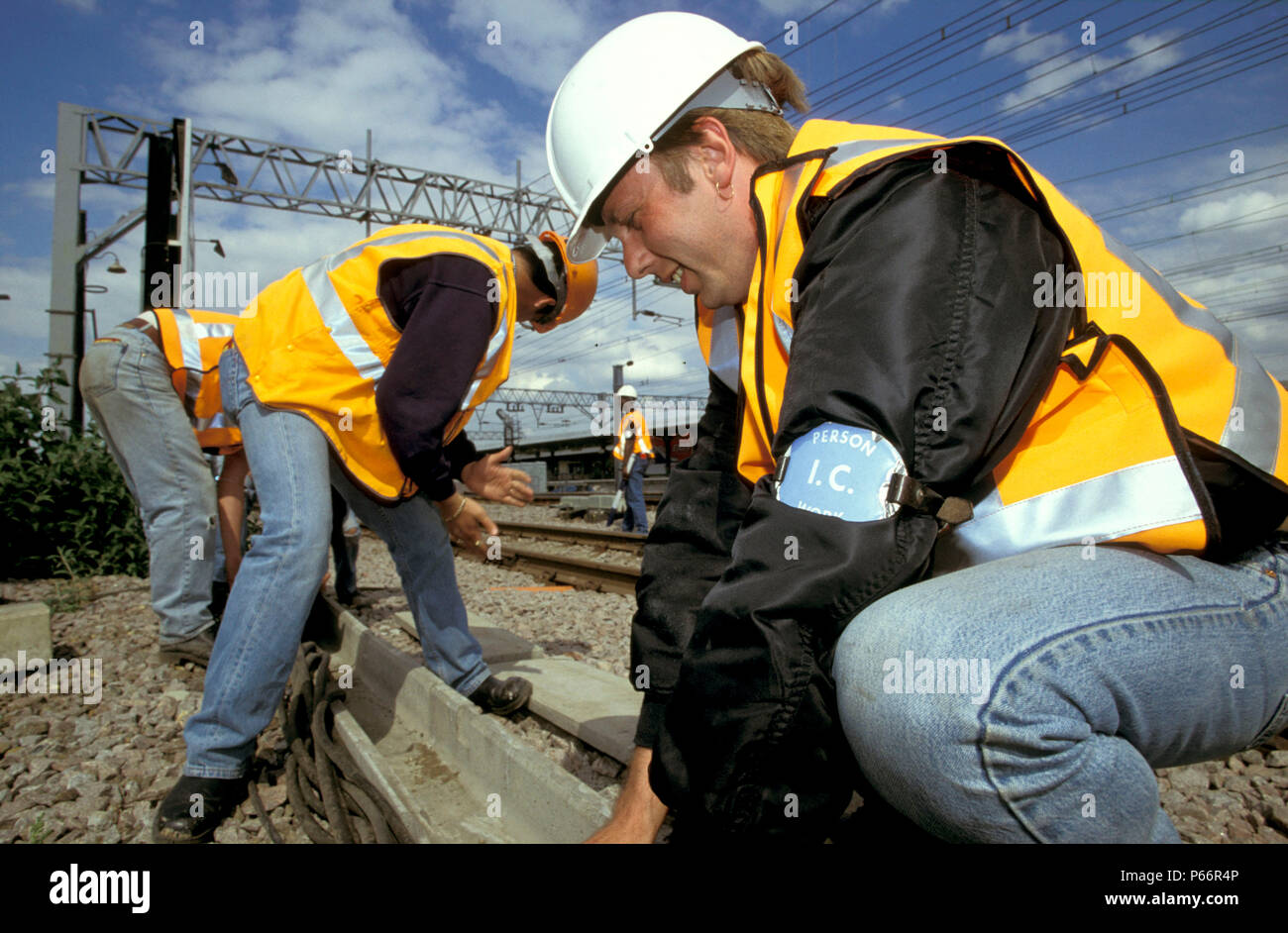 Laying cables in track-side ducting, PICOW in foreground. C1996 Stock ...