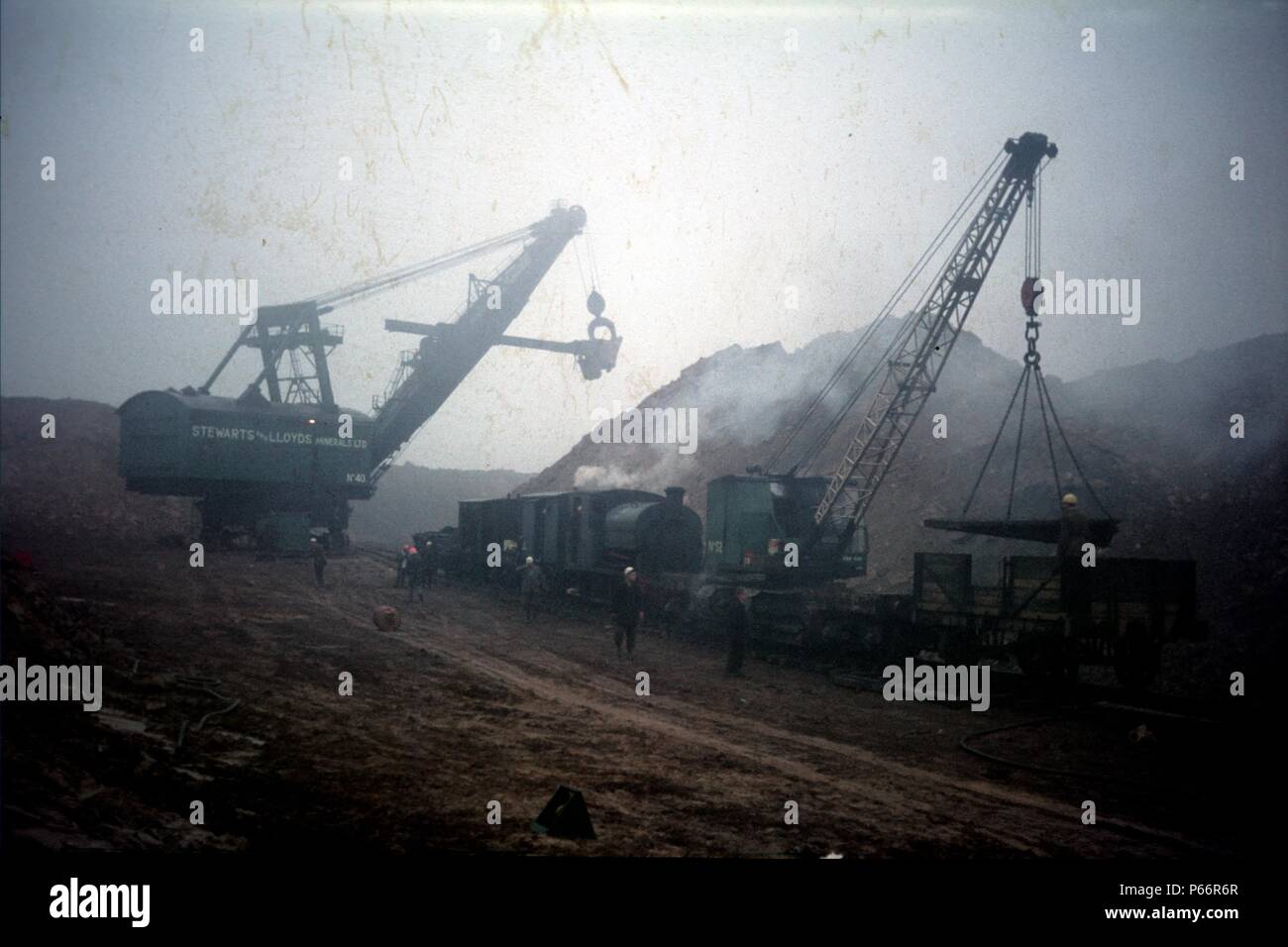 Loading iron ore into wagons to be conveyed to Corby Steelworks ...