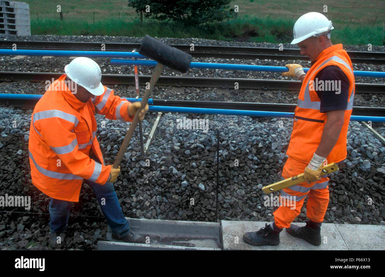 Vital Rail employees laying a cess path. 2003 Stock Photo - Alamy