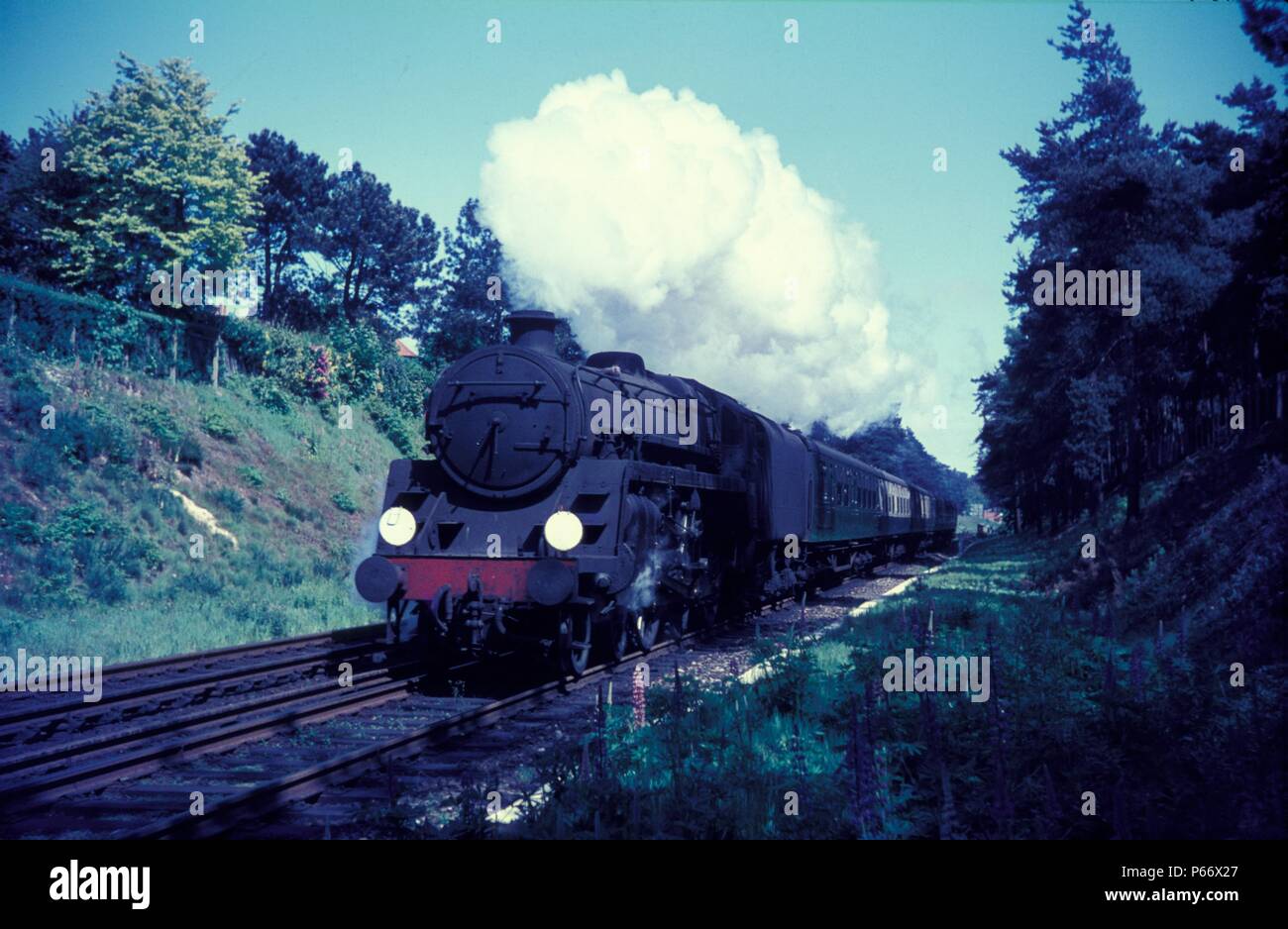 A British Railway's Standard Class 5 4-6-0, No.73118, heads away from ...