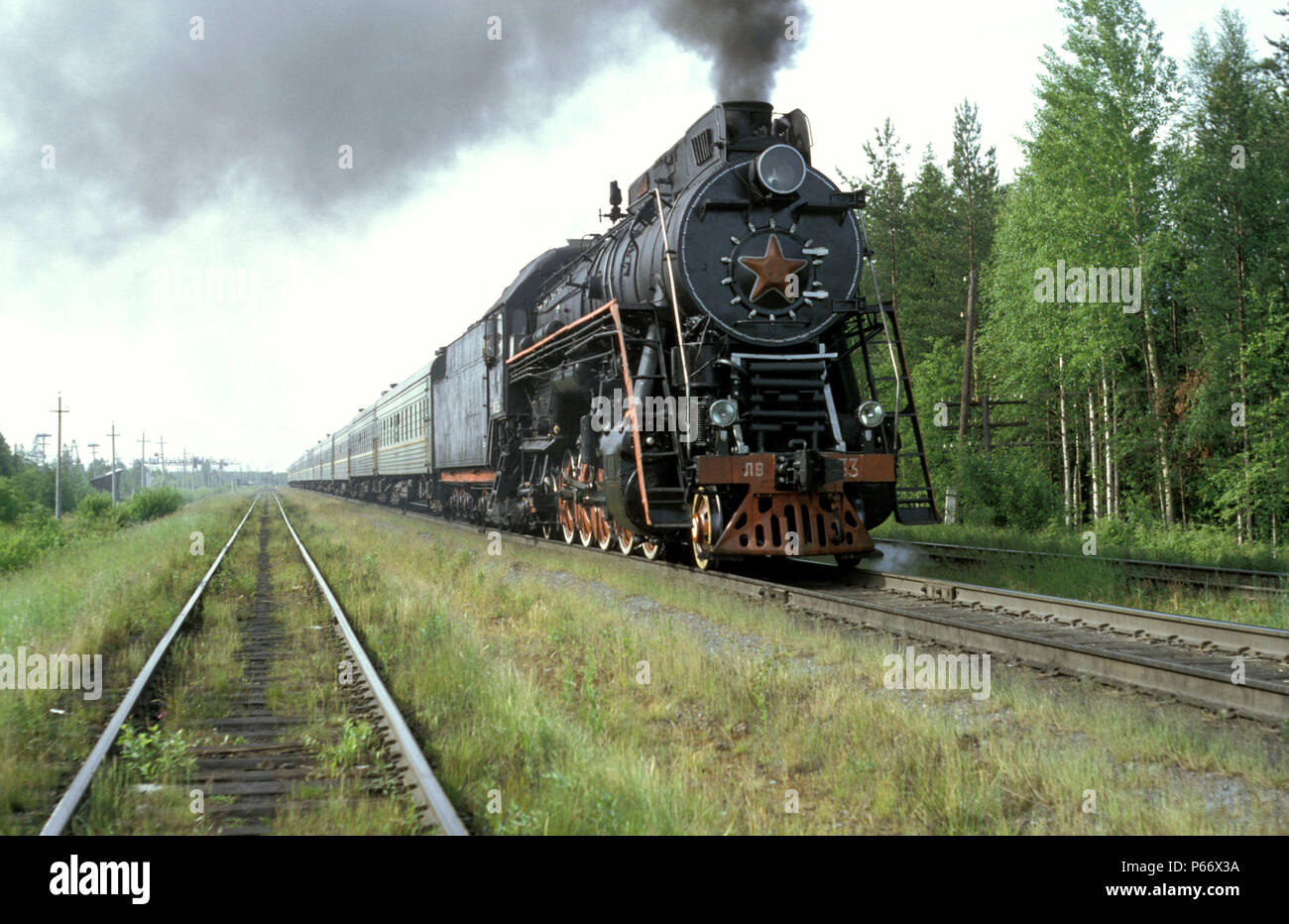 A Class LV, 2-10-2 with a special passenger train in Russia. July 1992 ...