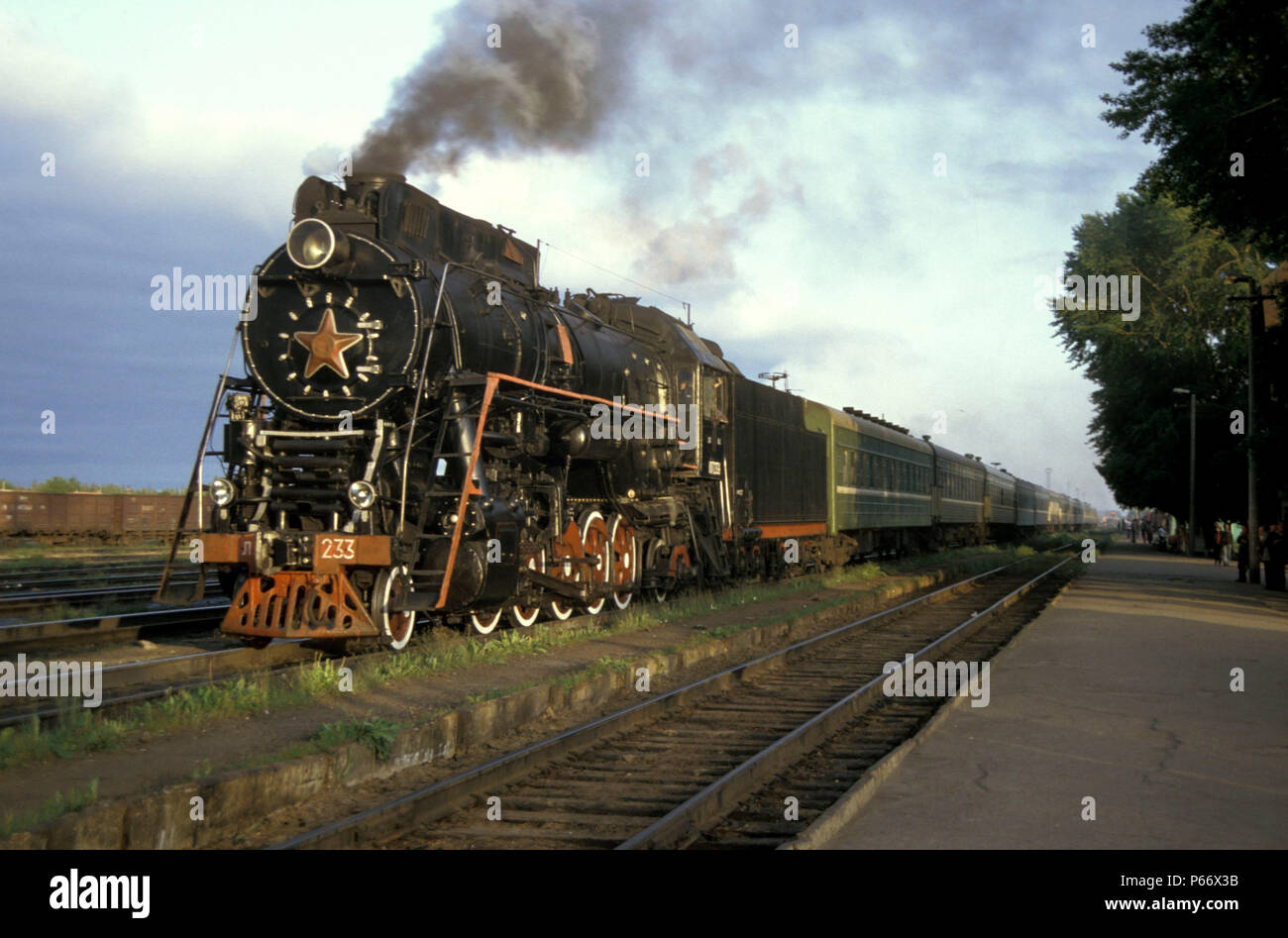 A Class LV, 2-10-2 with a special passenger train in Russia. July 1992 ...