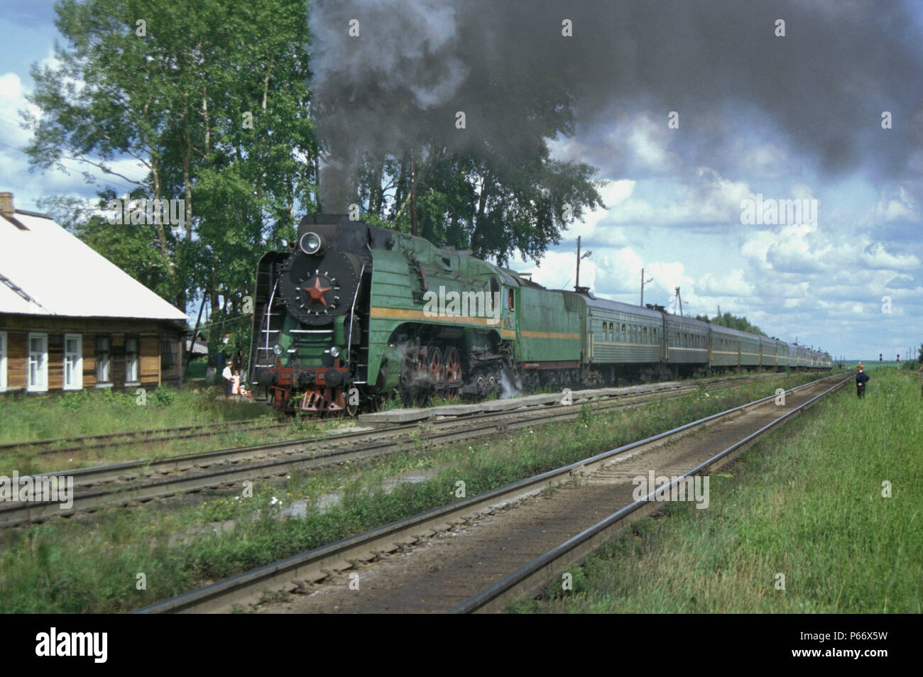 A P36 Class, 4-8-4 with a special passenger train in Russia. July 1992 ...
