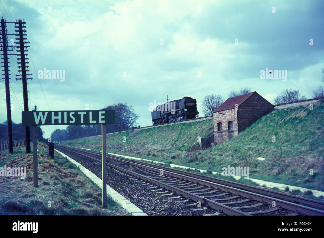 A re-built Bulleid Light Pacific heads, light engine, across Battledown ...