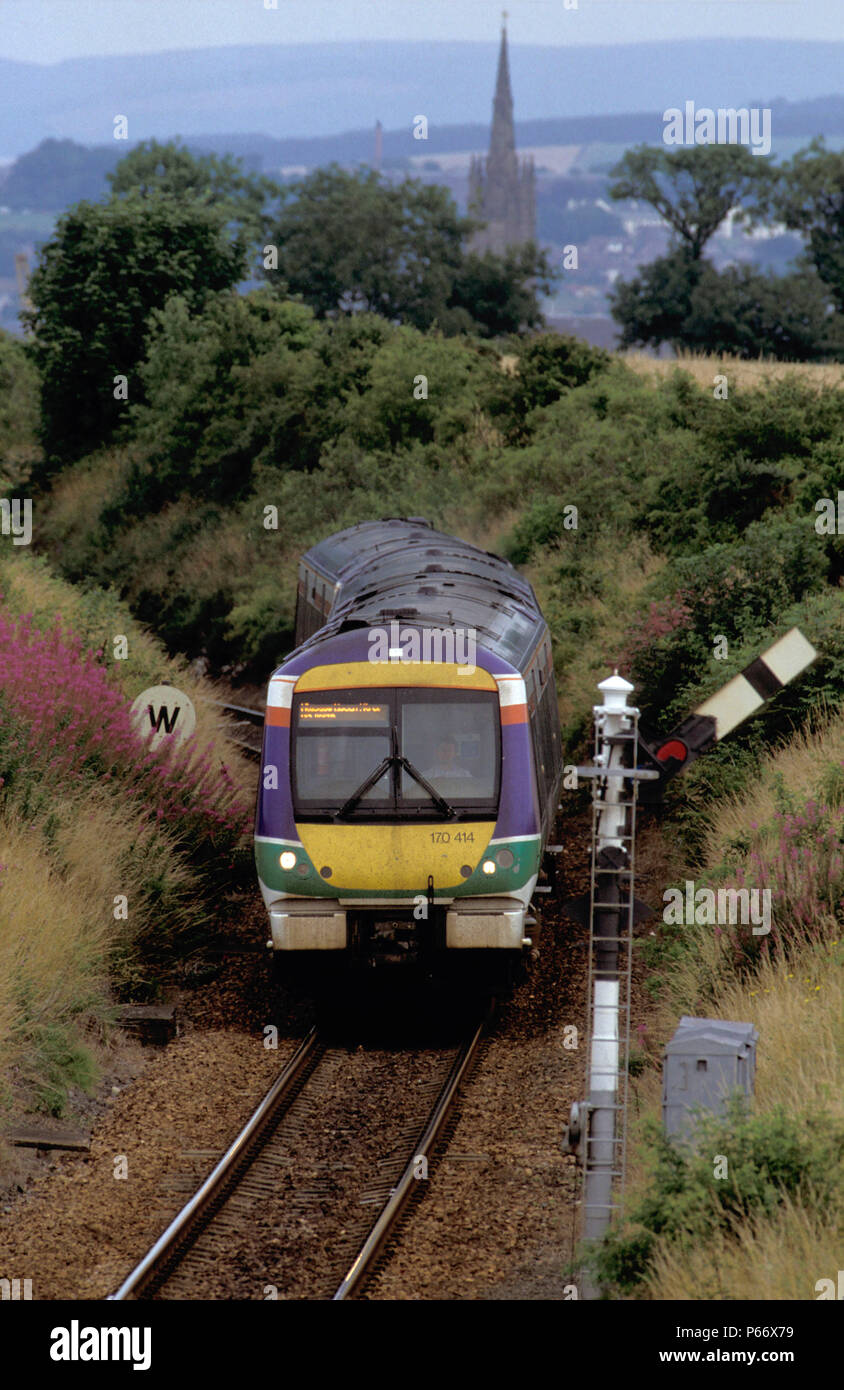 A Scotrail Class 170 DMU heads south from Montrose along the only ...