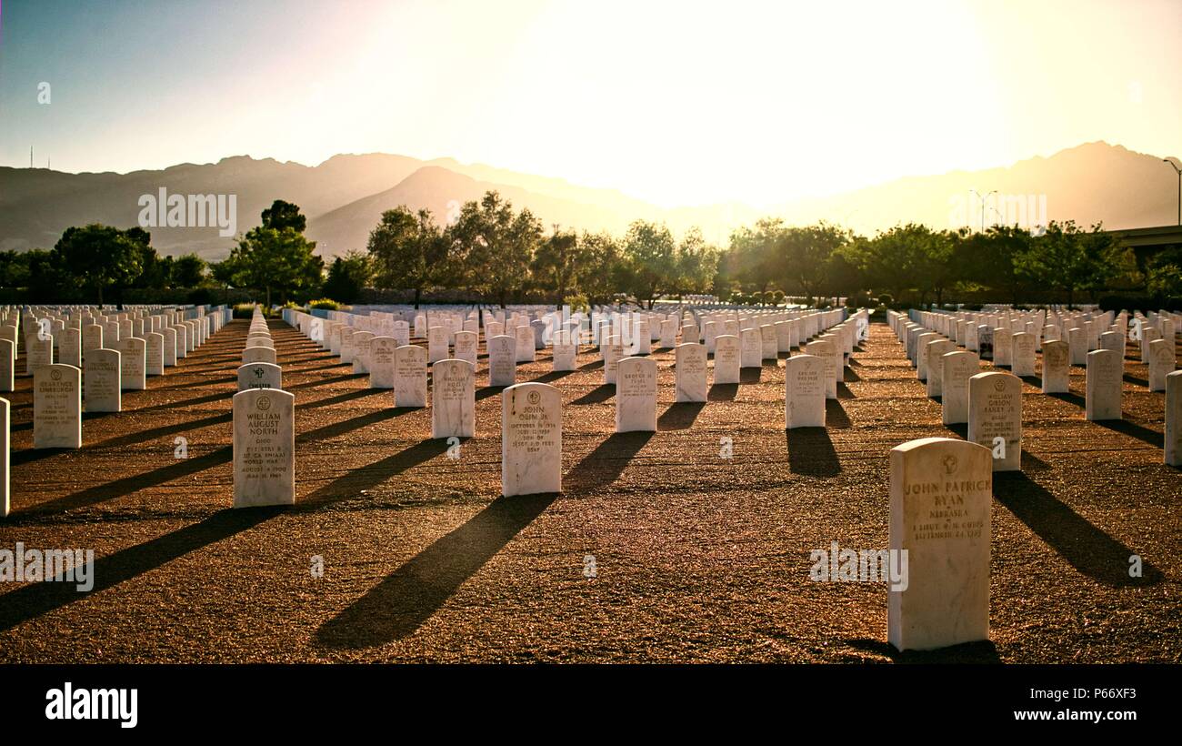 Sunset over cemetery Stock Photo - Alamy