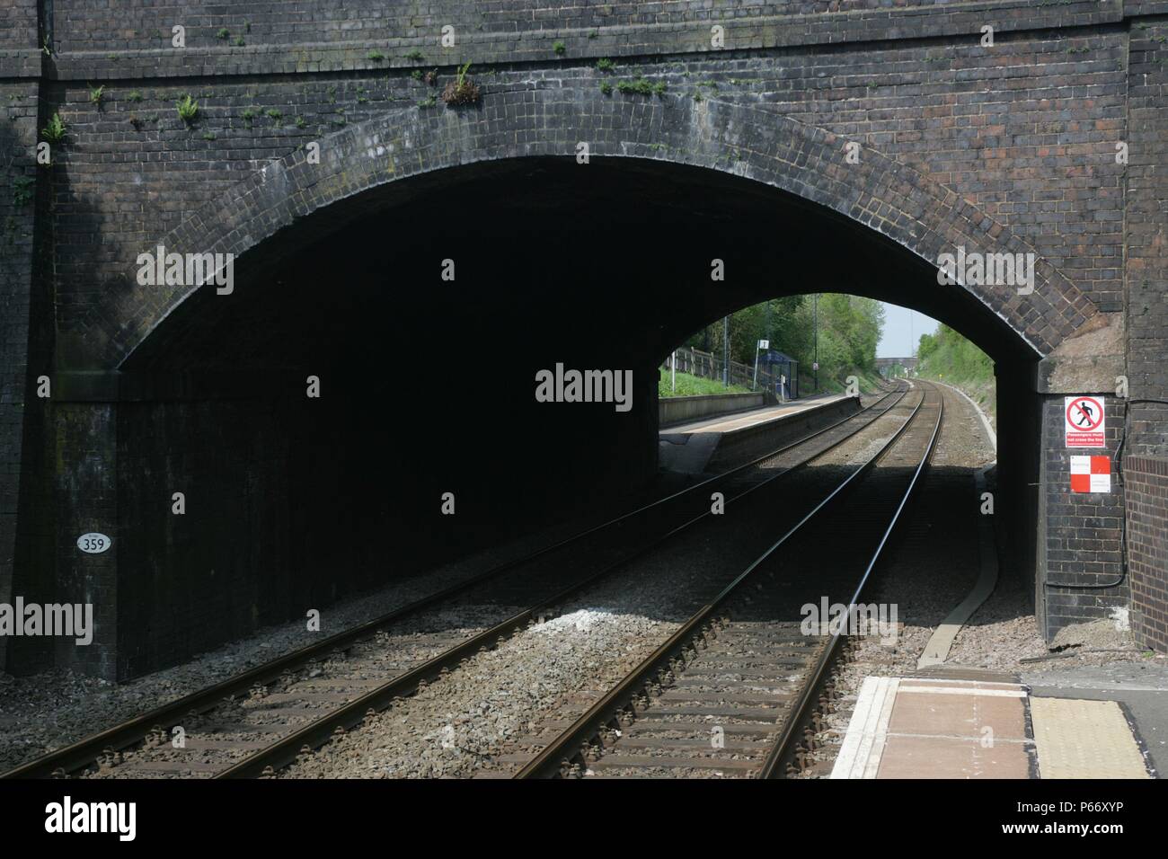 Down platform at Bilbrook station, Staffordshire through the arch of ...