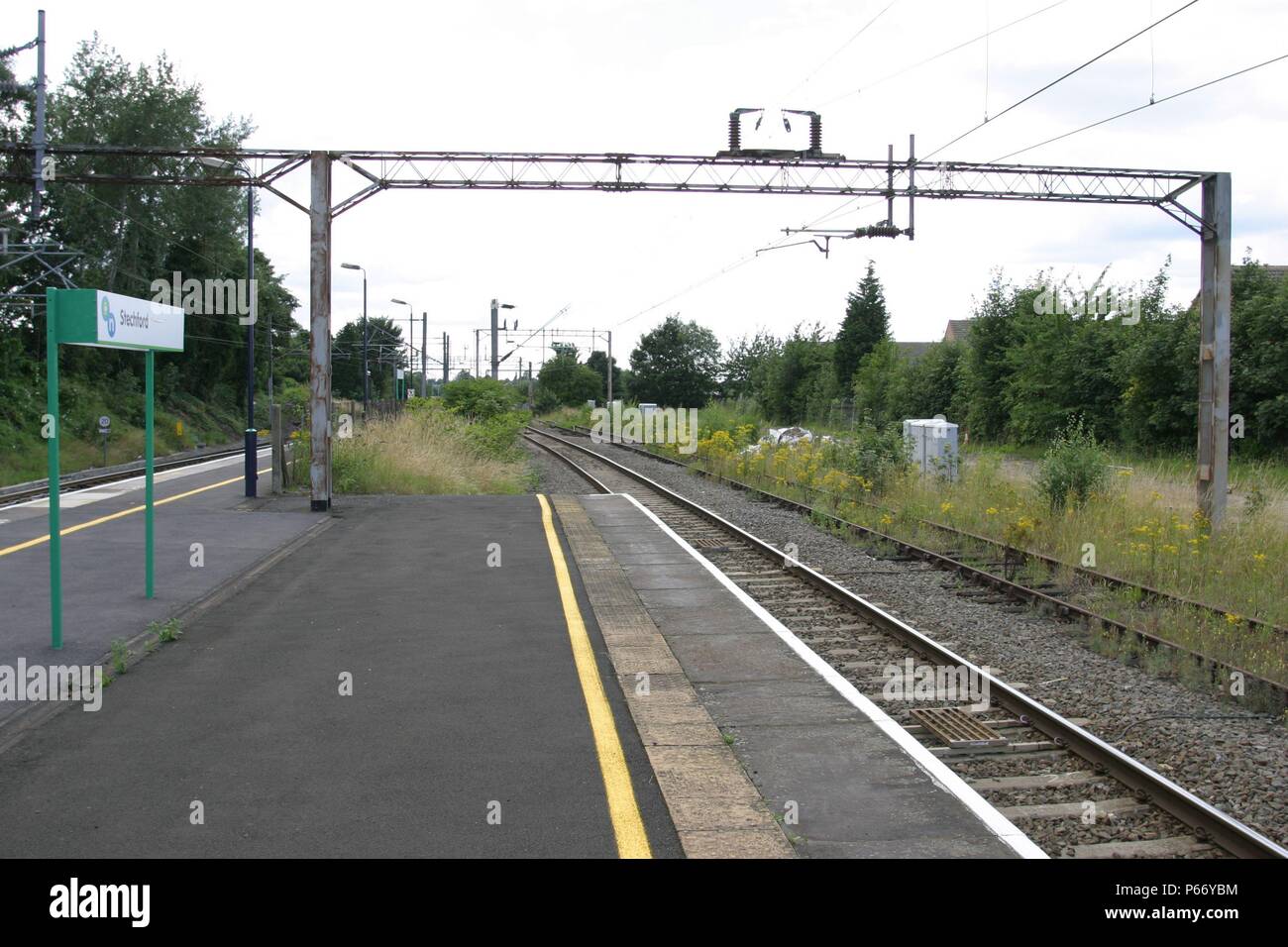 Platform end at Stechford station, West Midlands, showing vegitation ...