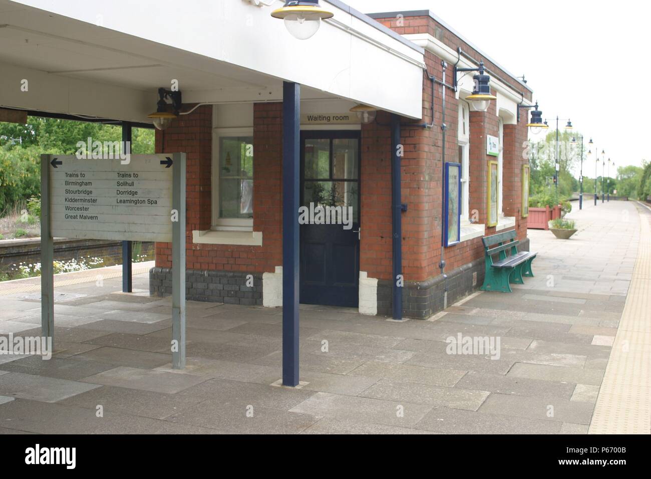 Signage and waiting room on the platform at Olton station, Birmingham ...