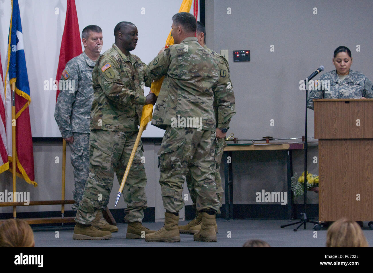 Brig. Gen. Sean A. Ryan passes the colors from the 136th Regiment's ...