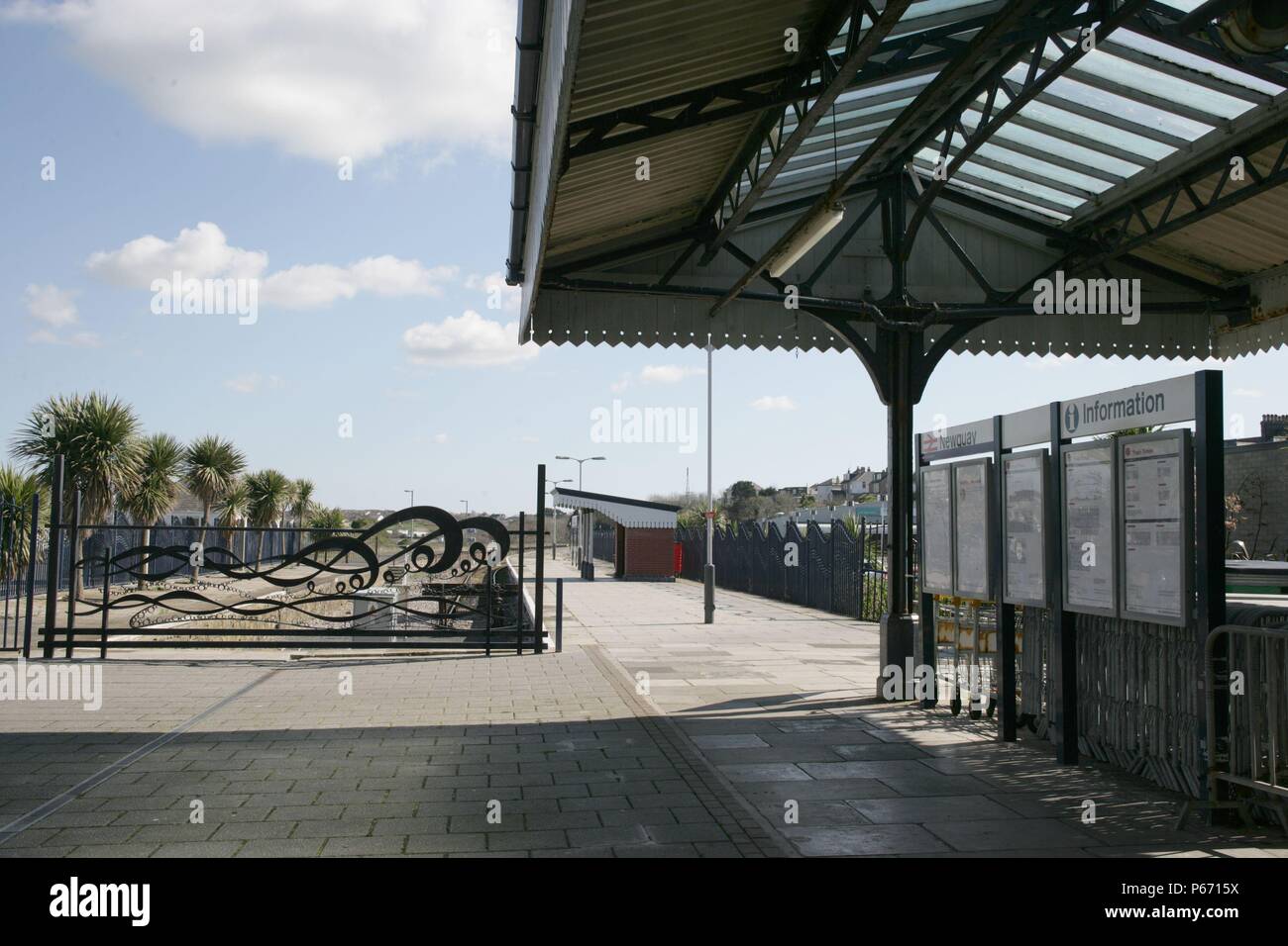 View along the platform at Newquay station, Cornwall, with decorated ...