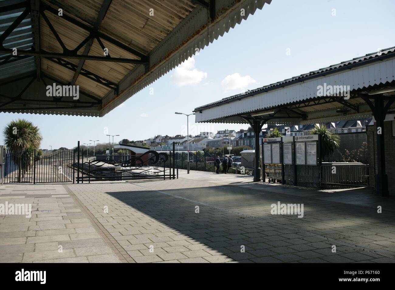 View along the platform at Newquay station, Cornwall, with decorated ...