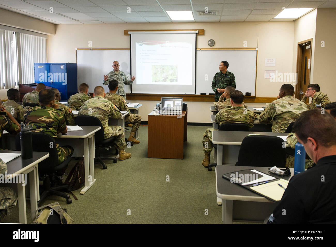 U.S. Army Sgt. 1st. Class Ray Andrade, left, Asia Pacific Counter IED ...