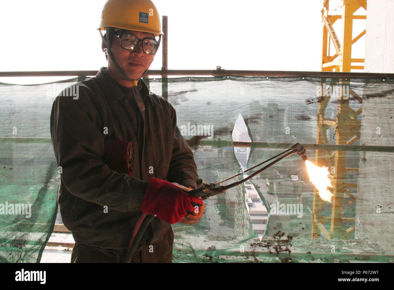 Construction worker with blow torch Stock Photo - Alamy