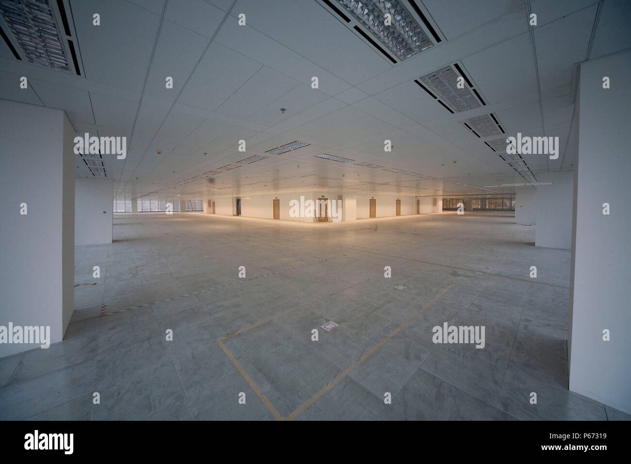 Empty floor of office building Stock Photo - Alamy