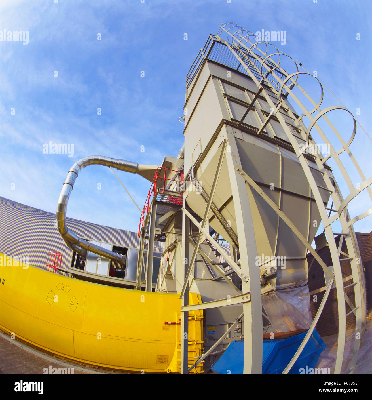 Wide angle view of hopper and pipes Stock Photo - Alamy