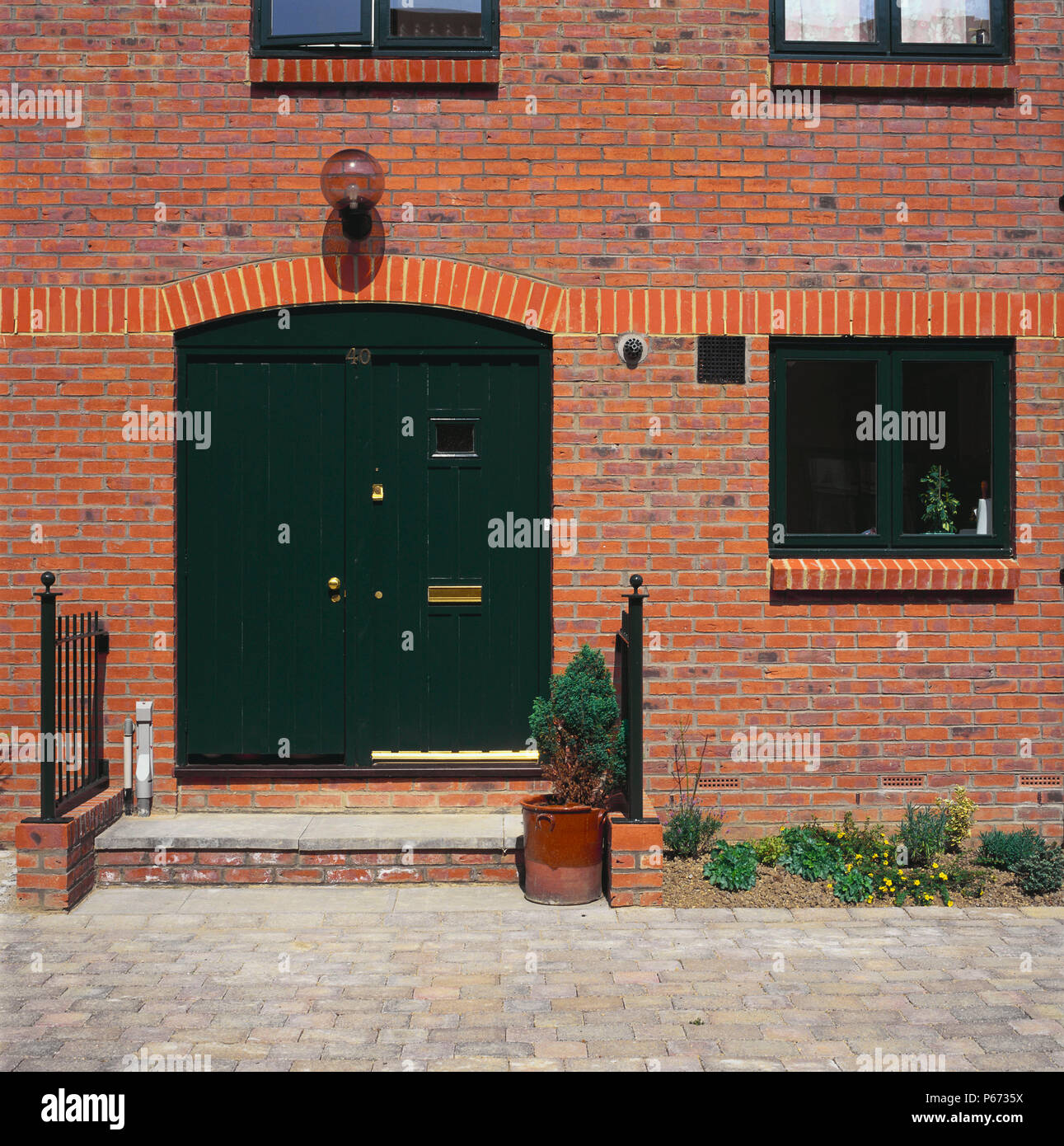 Detail of doorway on brick residential block Stock Photo - Alamy