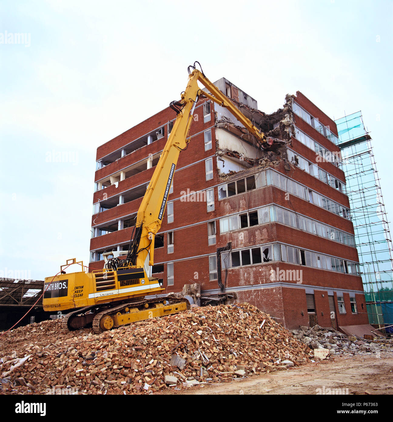 Tower block being demolished Stock Photo - Alamy