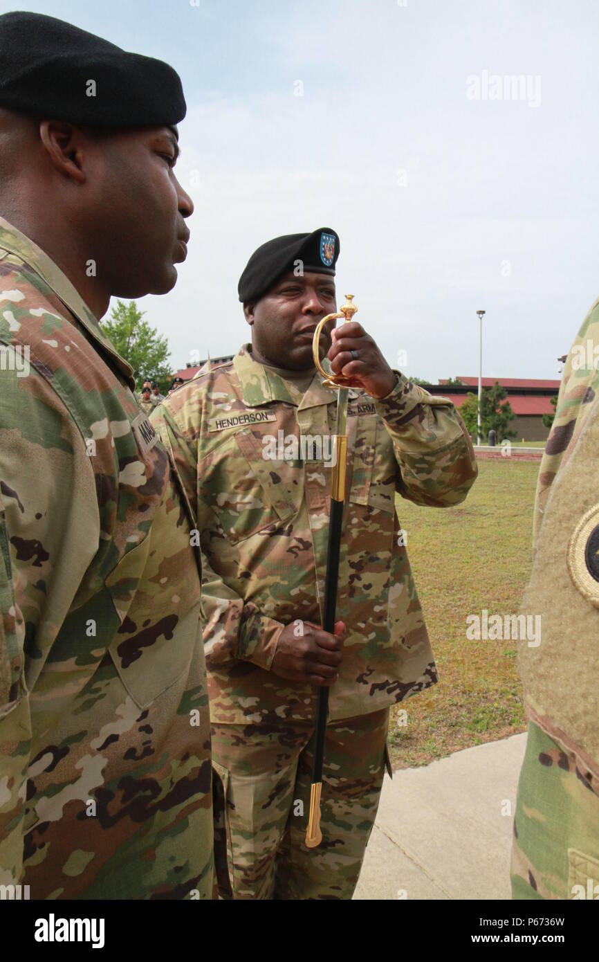 Command Sgt. Maj. Kevin D. Henderson (right), incoming command sergeant ...