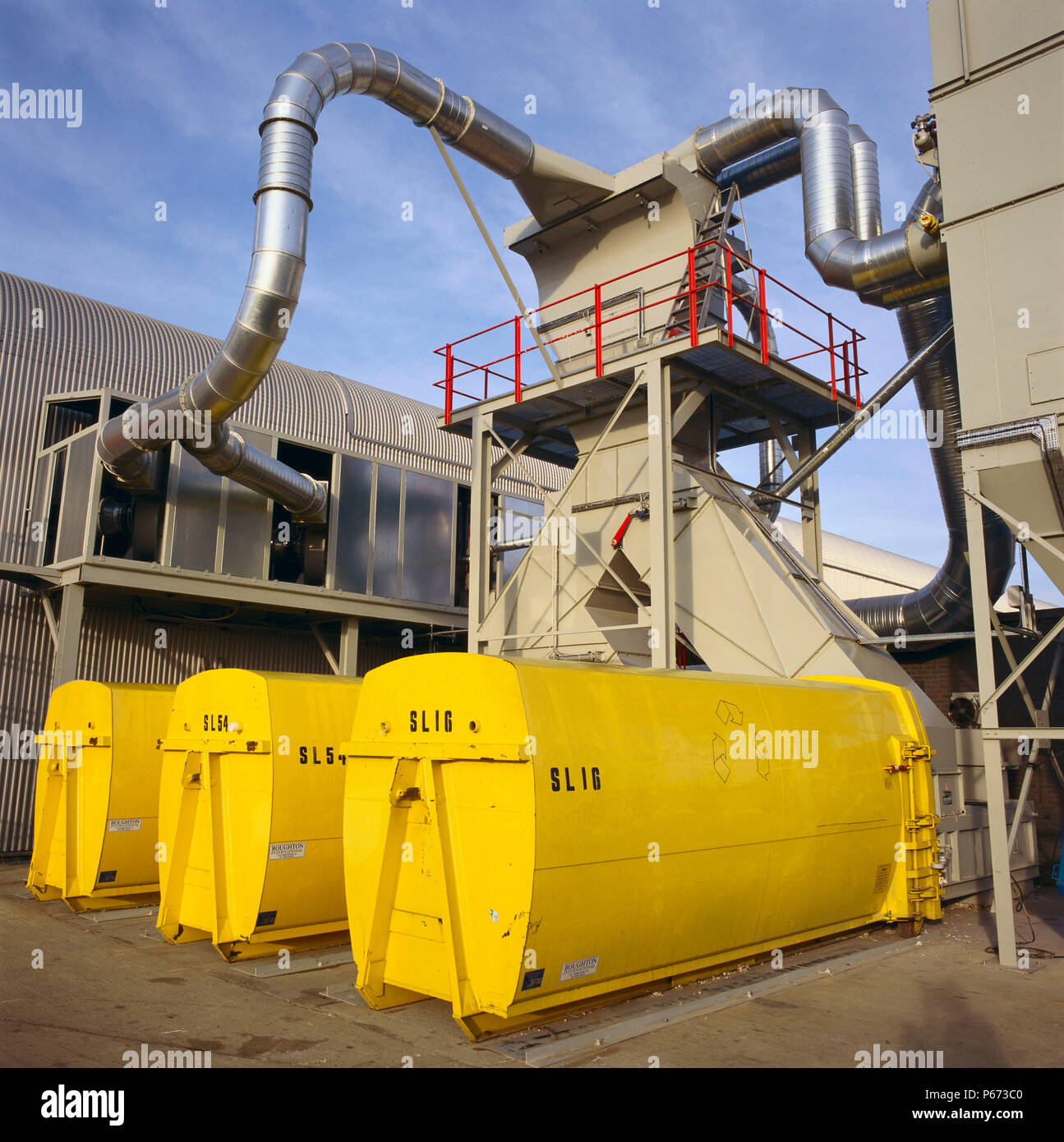 Extractor pipes and yellow waste storage tanks Stock Photo - Alamy