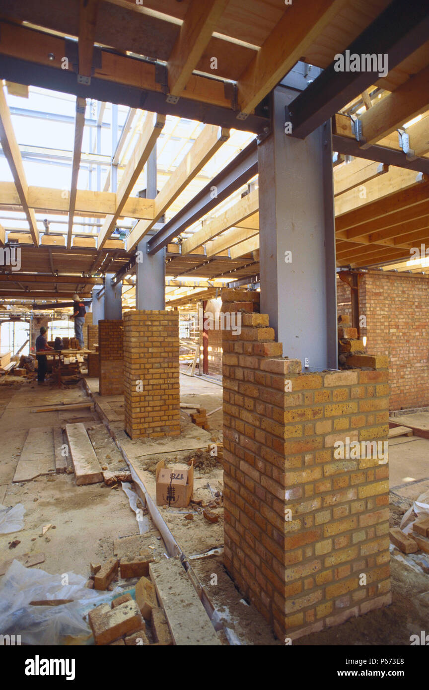 Brick cladding around steel columns on commercial building Stock Photo - Alamy