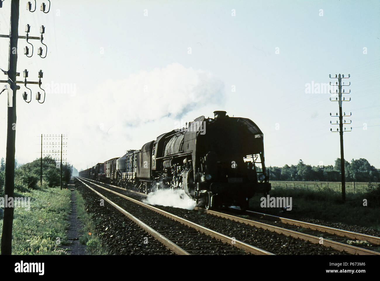 An American built SNCF 141R 2-8-2 rolls through the French countryside ...