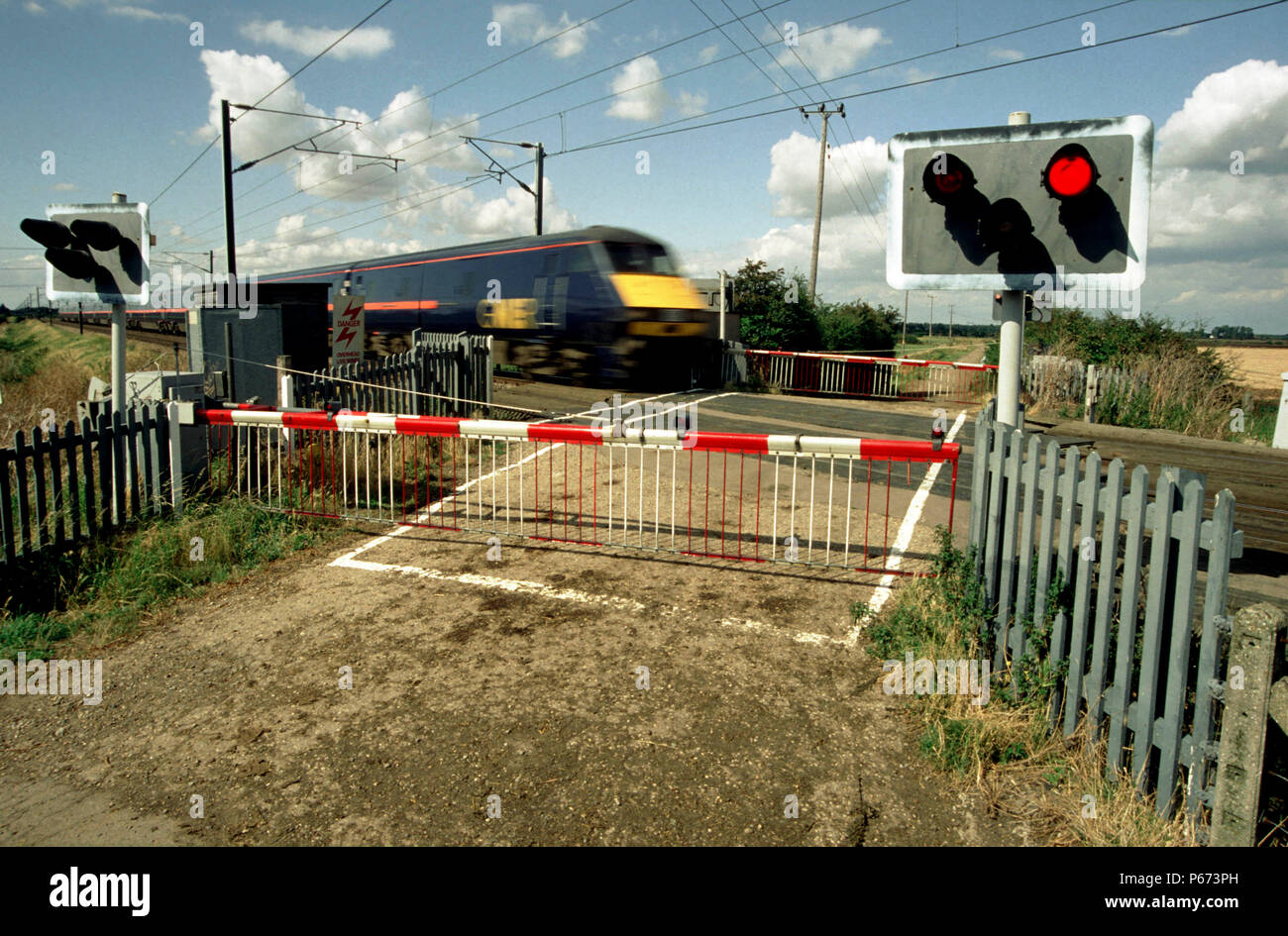 An express service to the north speeds past a typical country level ...