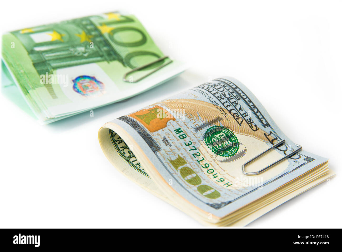 Stock of dollars and euros on the white Stock Photo - Alamy