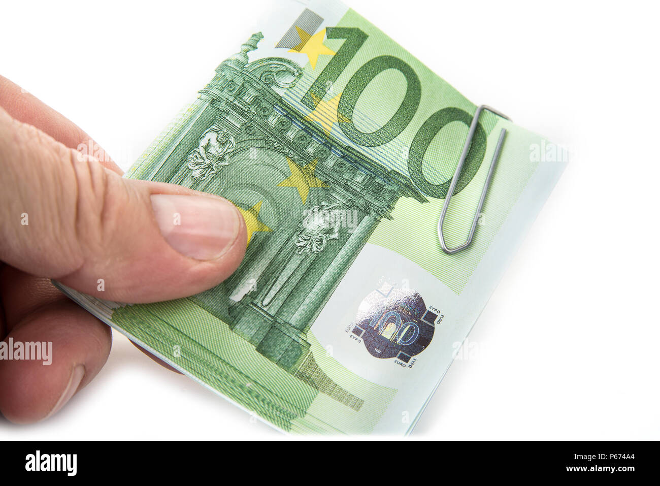 Stock of euros with paper clip on the white Stock Photo - Alamy
