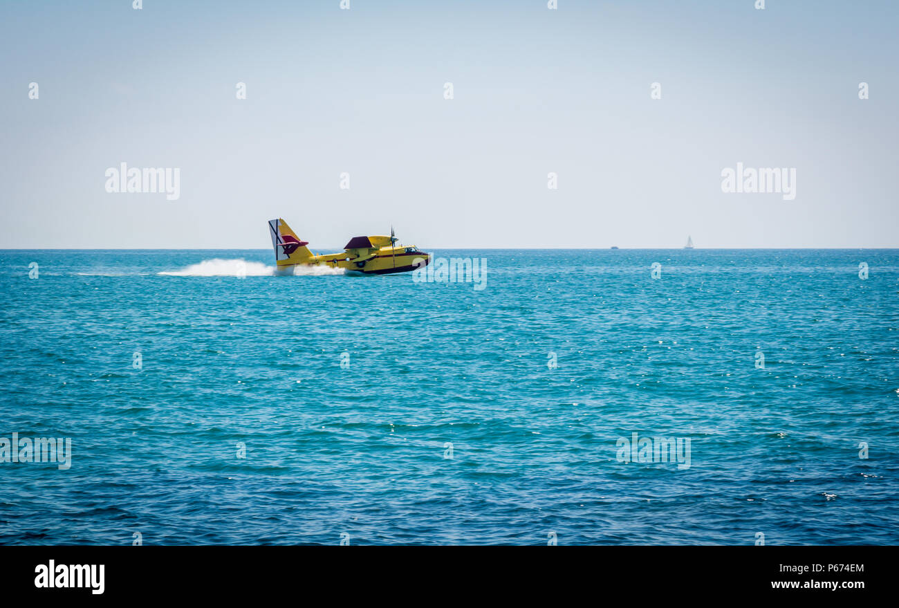 Firefighting aircraft in an emergency situation, water intake Stock ...