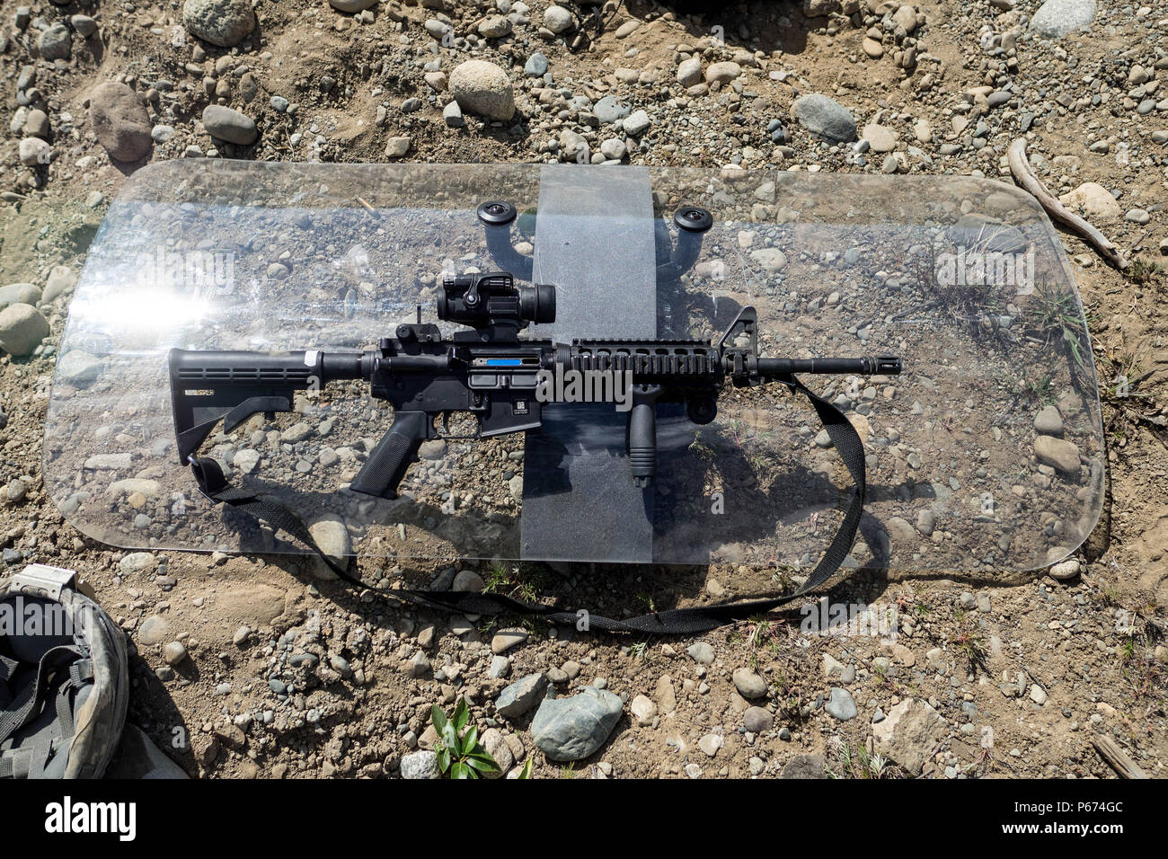 An M-4 Carbine and a riot shield rest May 14, 2016, at the Alaska ...