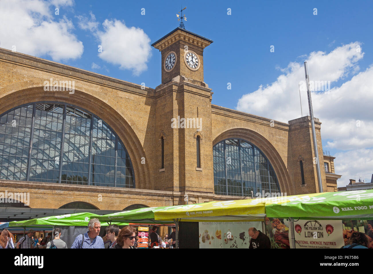 London, Borough of Camden King's Cross Station framed by a market on ...