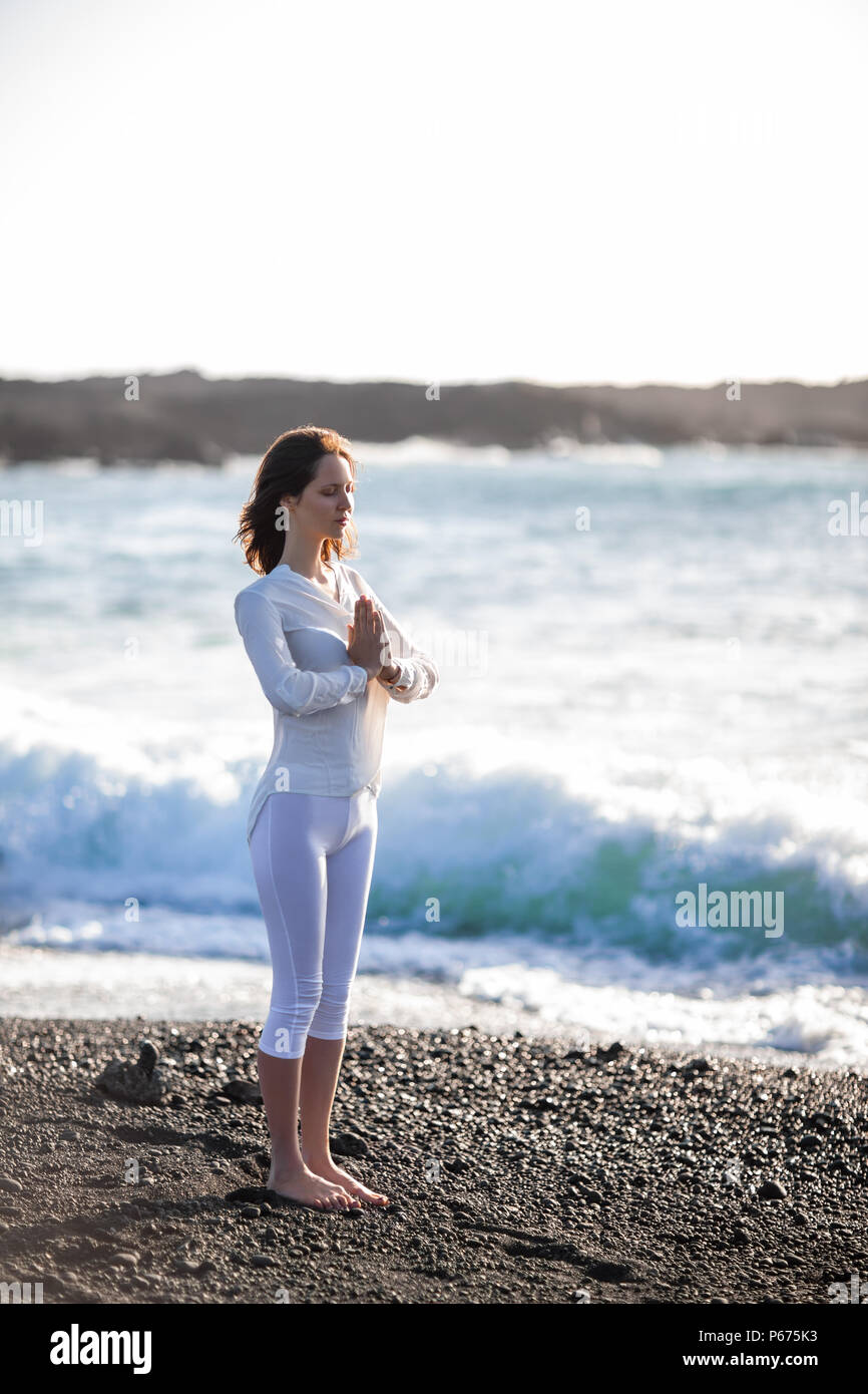 Praying on the beach hi-res stock photography and images - Alamy