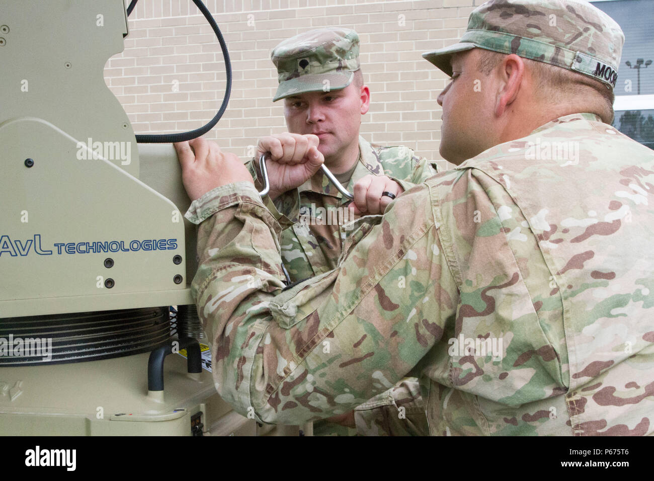 CAMP ATTERBURY, Ind. - Spcs. Justin Springer and John Moore, satellite ...