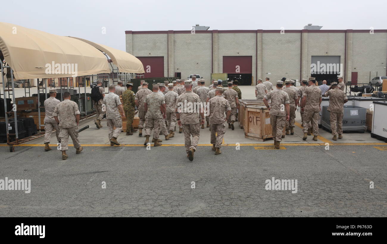 U.S. Marines and international military visitors tour the capabilities ...