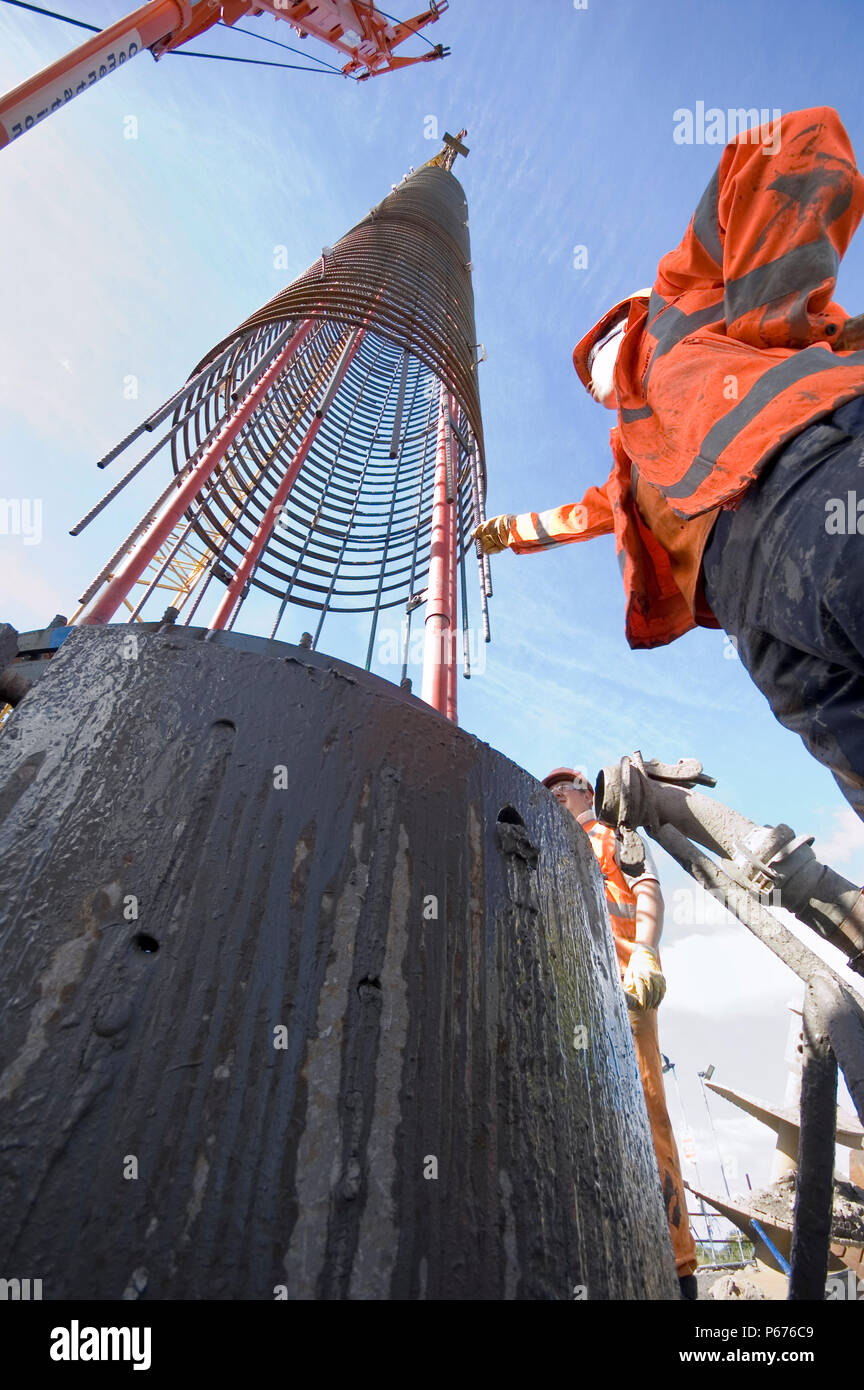 Construction crew at work fitting reinforcing into the piling Stock ...