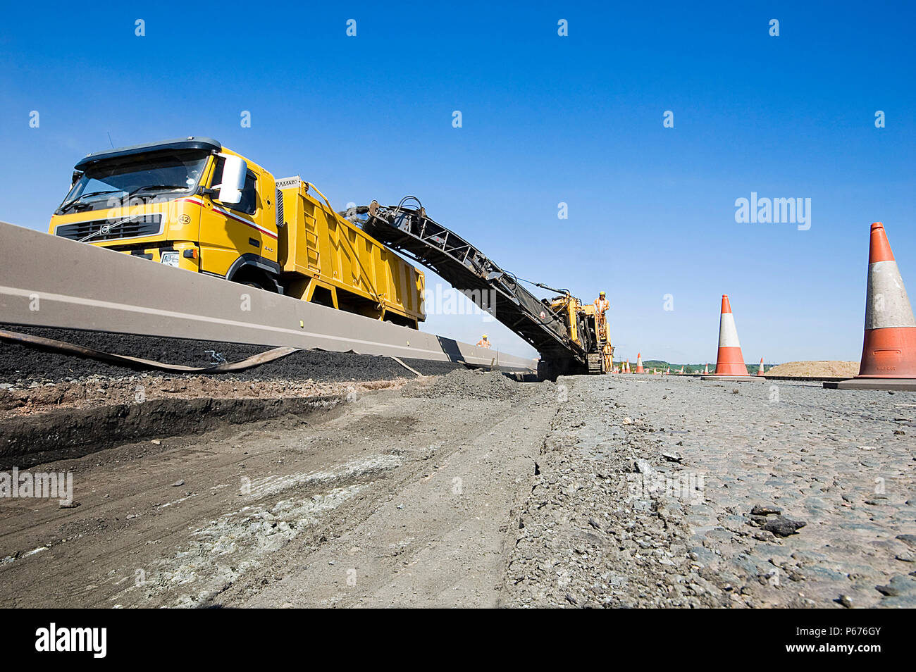 Plaining machine removing old tarmac surface Stock Photo - Alamy