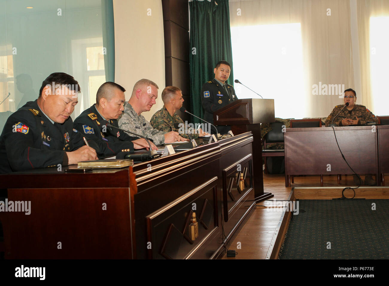 Mongolian Armed Forces Col. L.Ganselem, left, Mongolian Armed Forces ...
