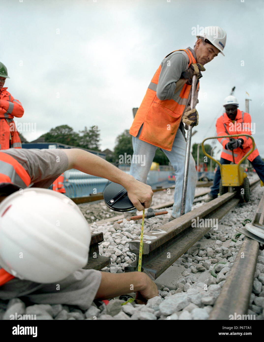 Rail Workers Laying Track Stock Photo - Alamy